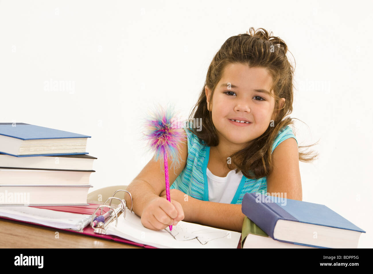 Child working on homework on white background Stock Photo - Alamy