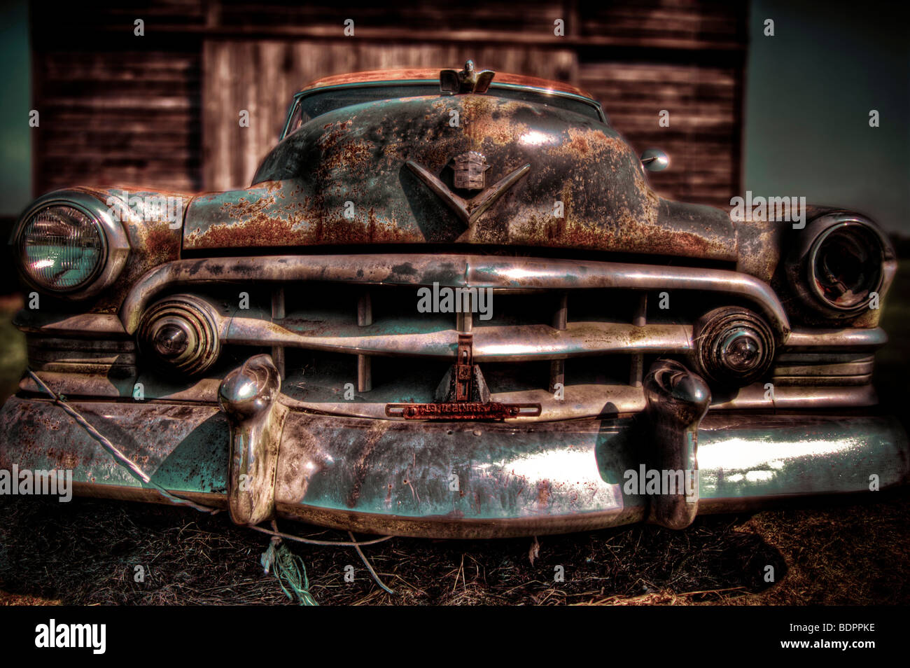 A 1950's American Cadilac car with rust and chrome bumper Stock Photo ...