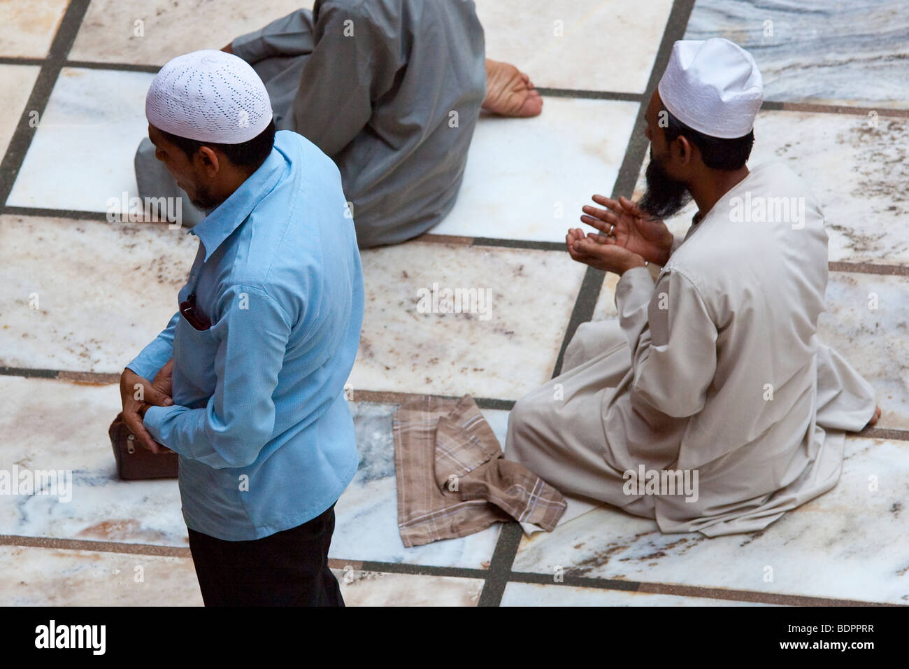 Indian muslim men wearing traditional hi-res stock photography and ...