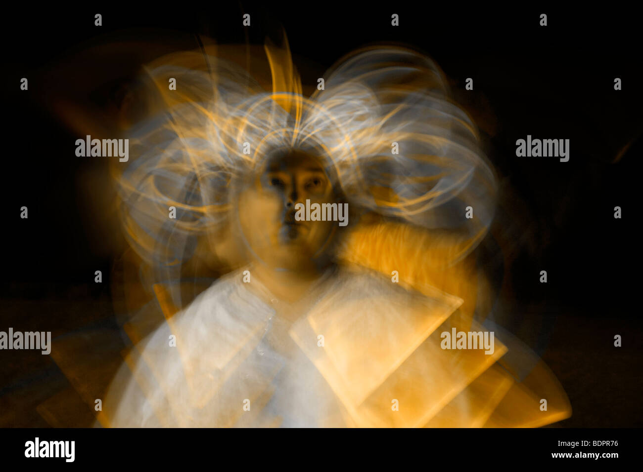 The face of a young man glowing with light effects Stock Photo - Alamy