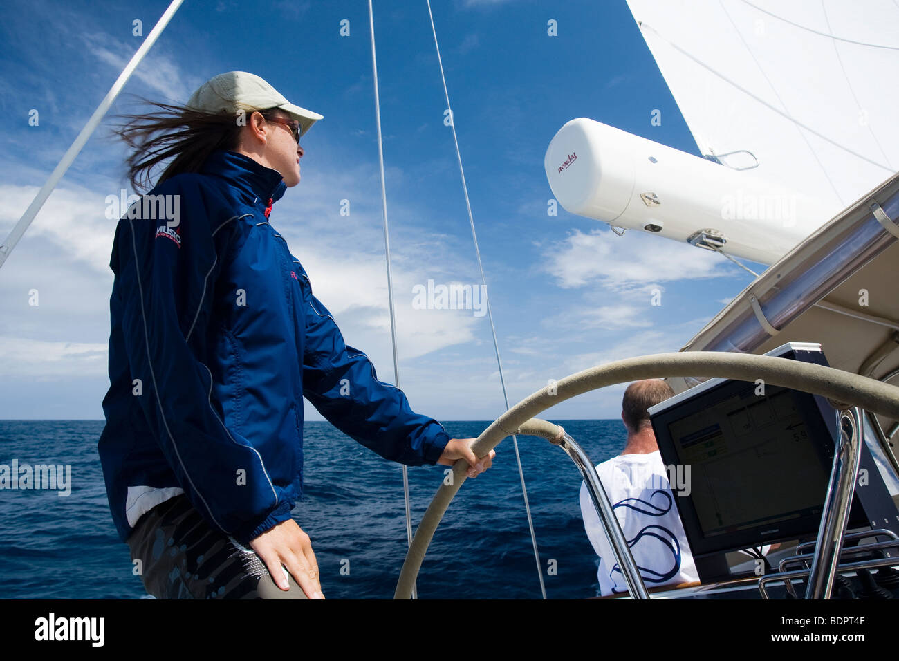 A yacht speeds through the North Atlantic ocean, a woman is sailing the ...