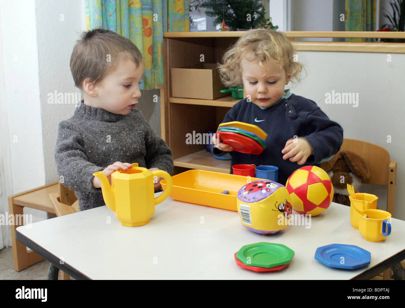 Little children at Kindergarten class playing together Stock Photo - Alamy