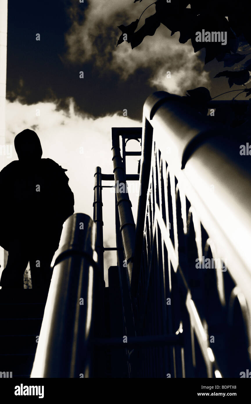 A silhouette of a young man on a walkway Stock Photo - Alamy