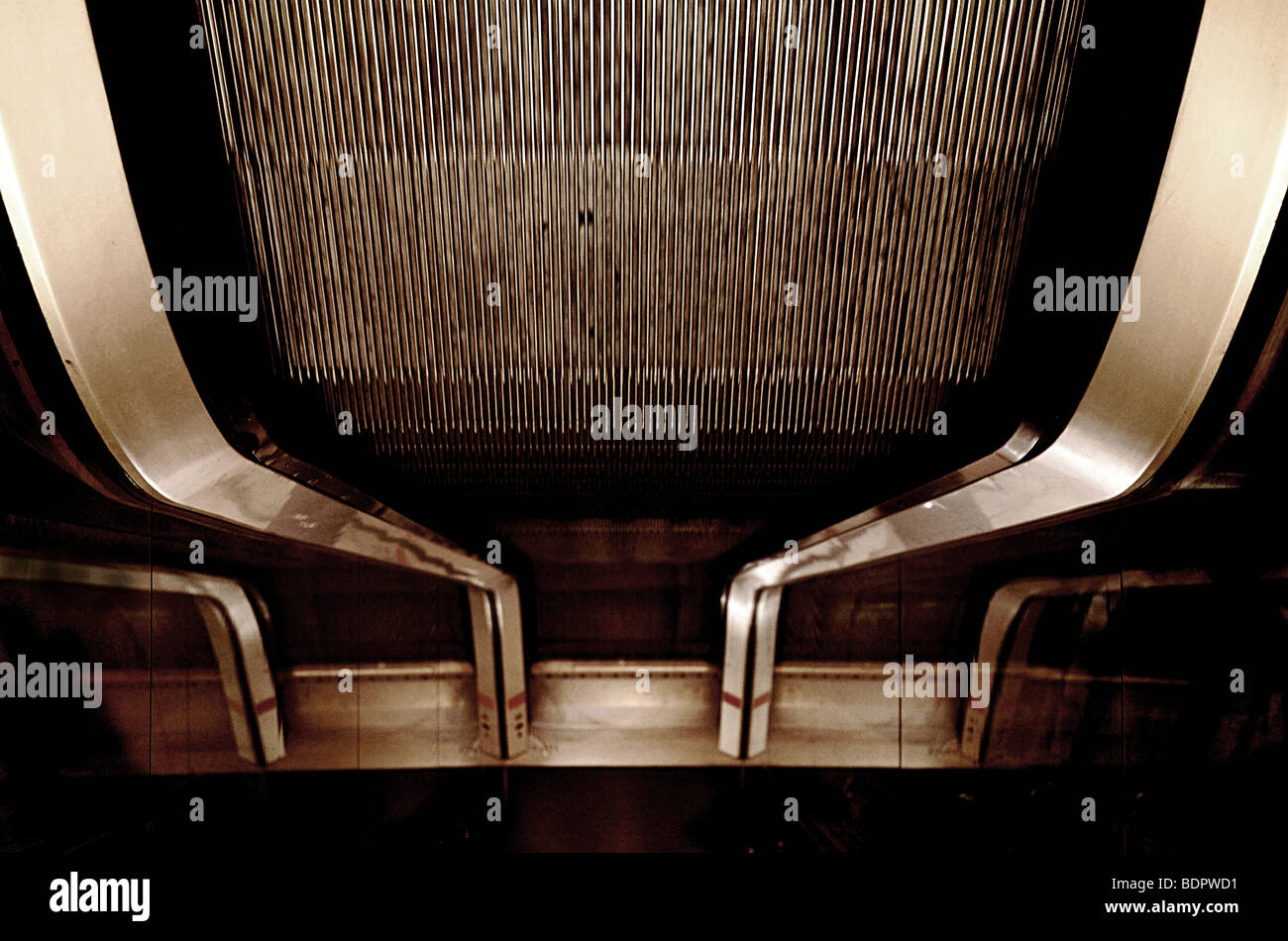 The shiny metal surface of an escalator Stock Photo - Alamy