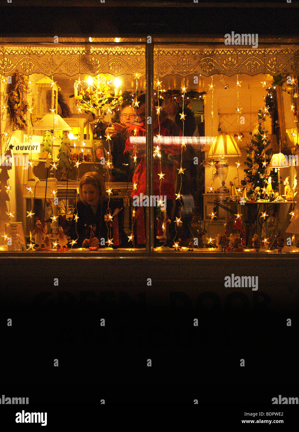 A view into a shop window at night time Stock Photo - Alamy