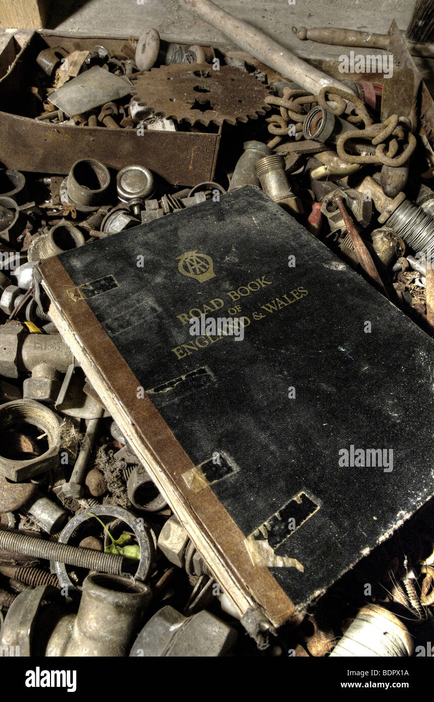 An old black book of AA road maps in a box of old nuts and bolts Stock ...