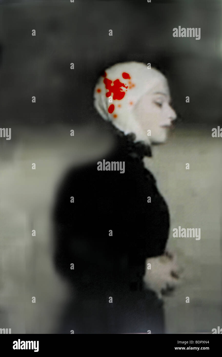 A woman with blood on her head Stock Photo - Alamy