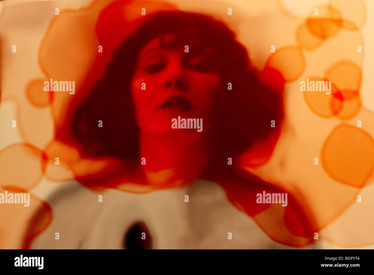 A womans face in red Stock Photo - Alamy