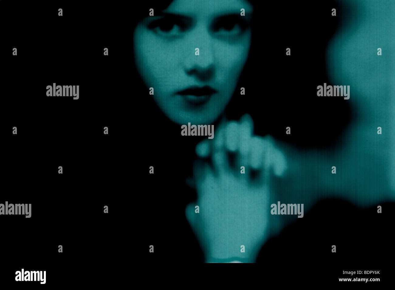 A young womans face in green Stock Photo - Alamy