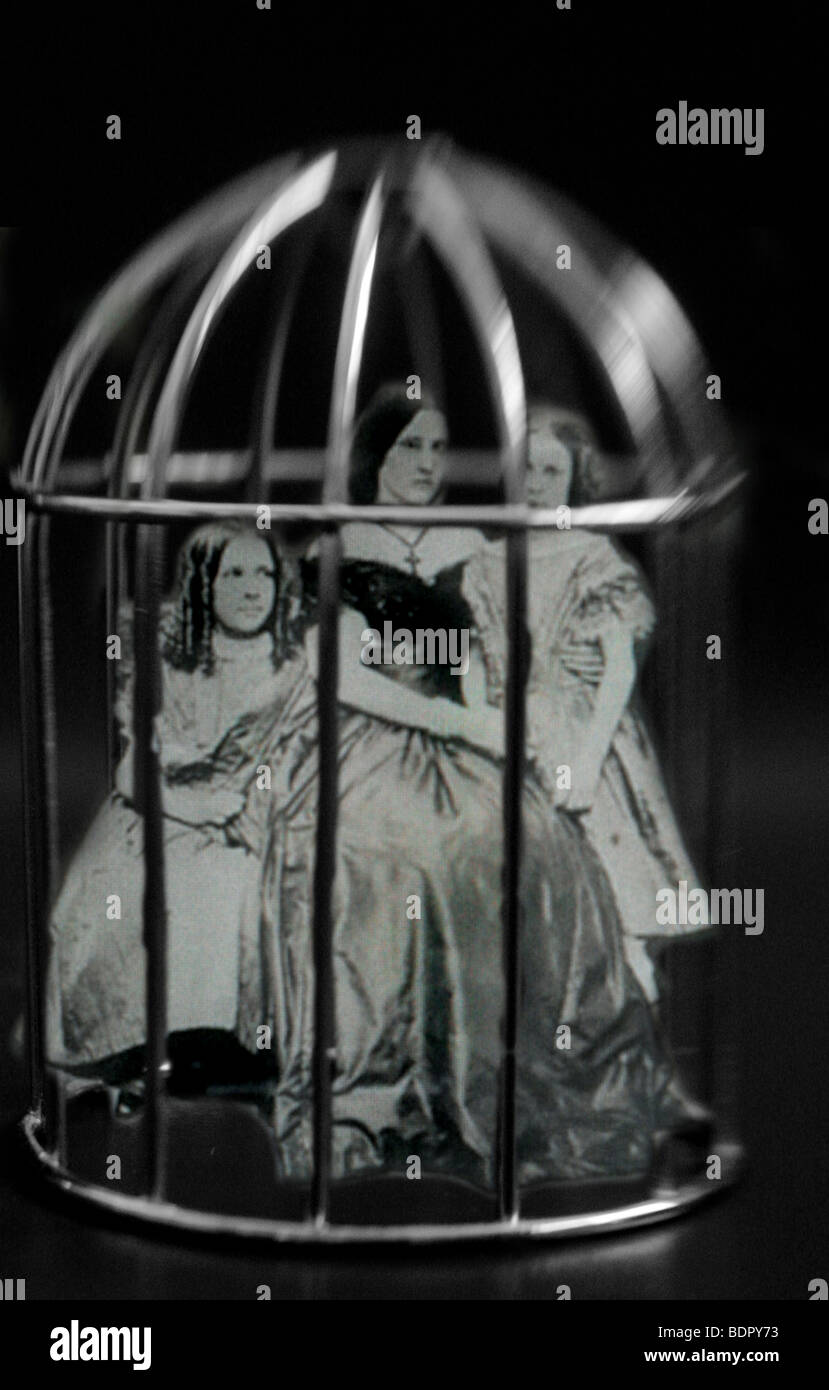 Three figures in a cage Stock Photo - Alamy