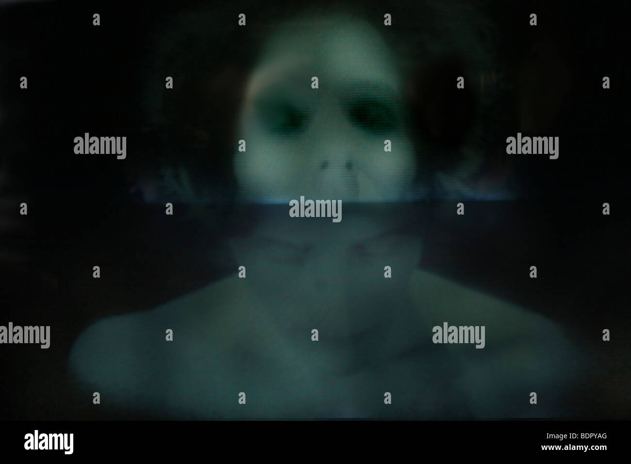 A womans face in green Stock Photo - Alamy