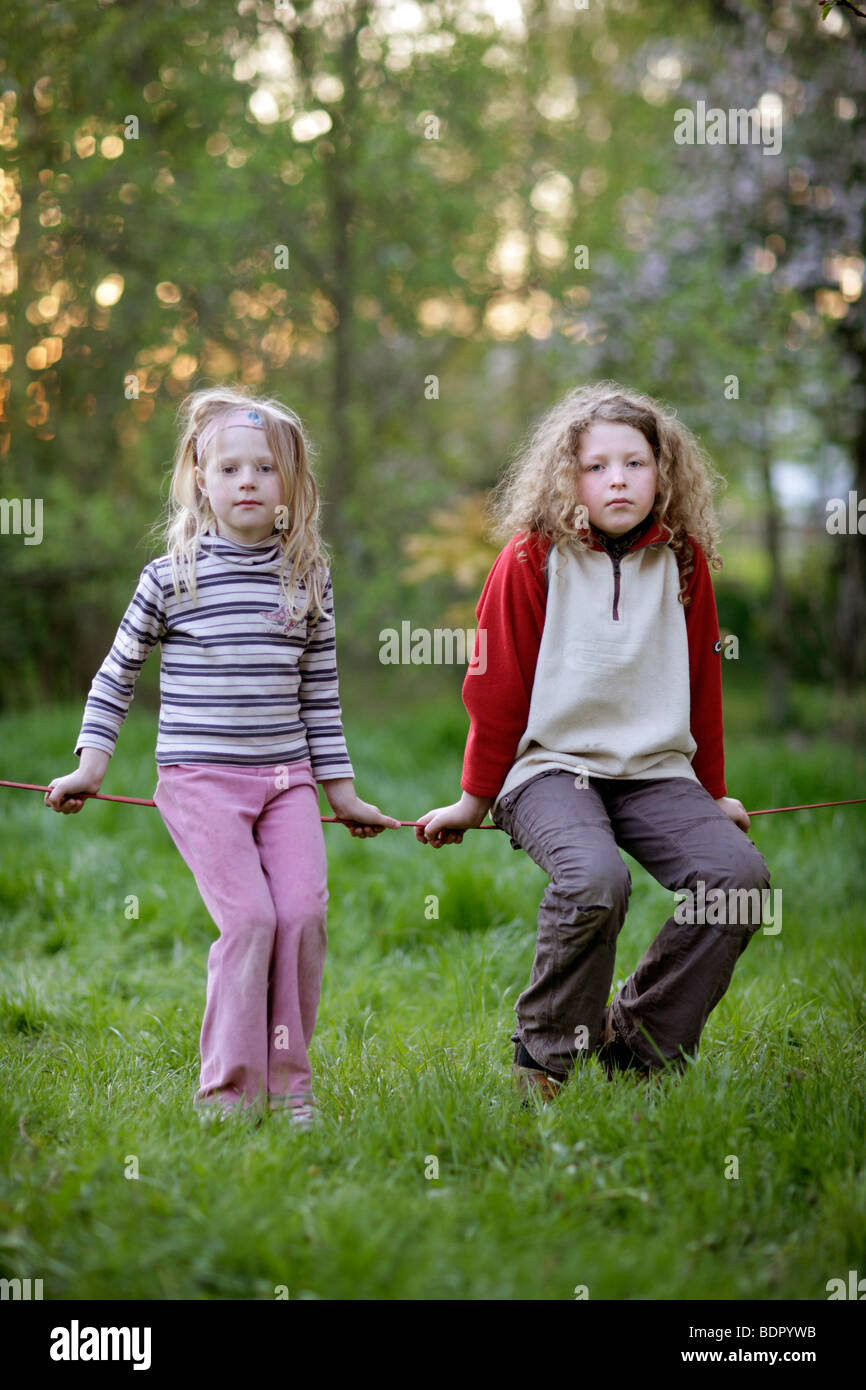 Girls playing together Stock Photo - Alamy
