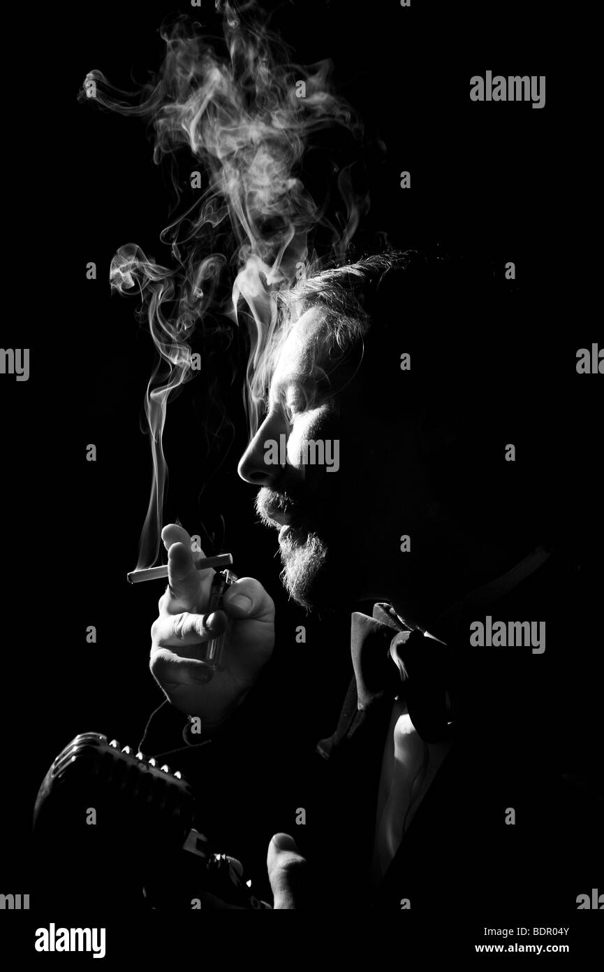 A male singer smoking a cigarette Stock Photo - Alamy