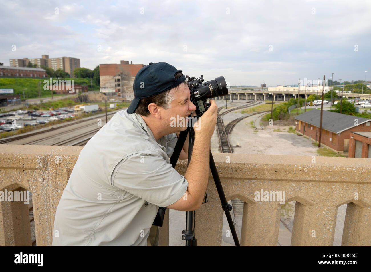 Professional photographer captures an interesting subject from a bridge ...
