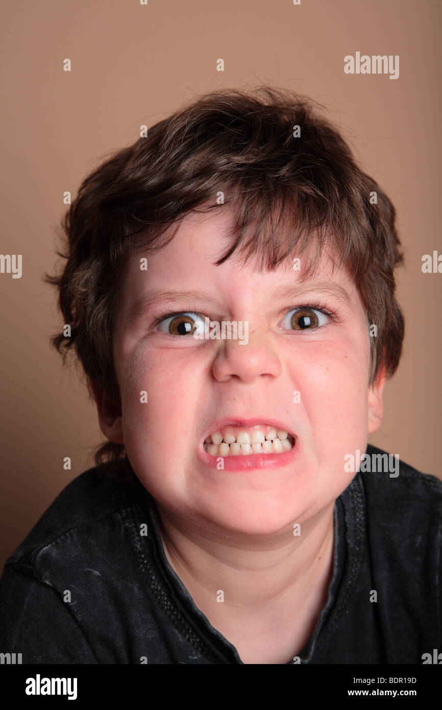 Young boy making faces Stock Photo - Alamy
