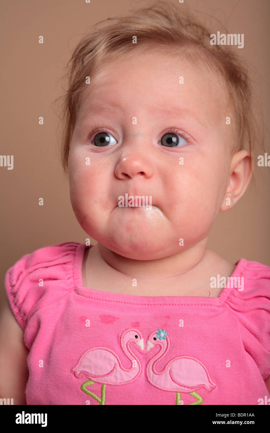 Infant girl expression shy hi-res stock photography and images - Alamy