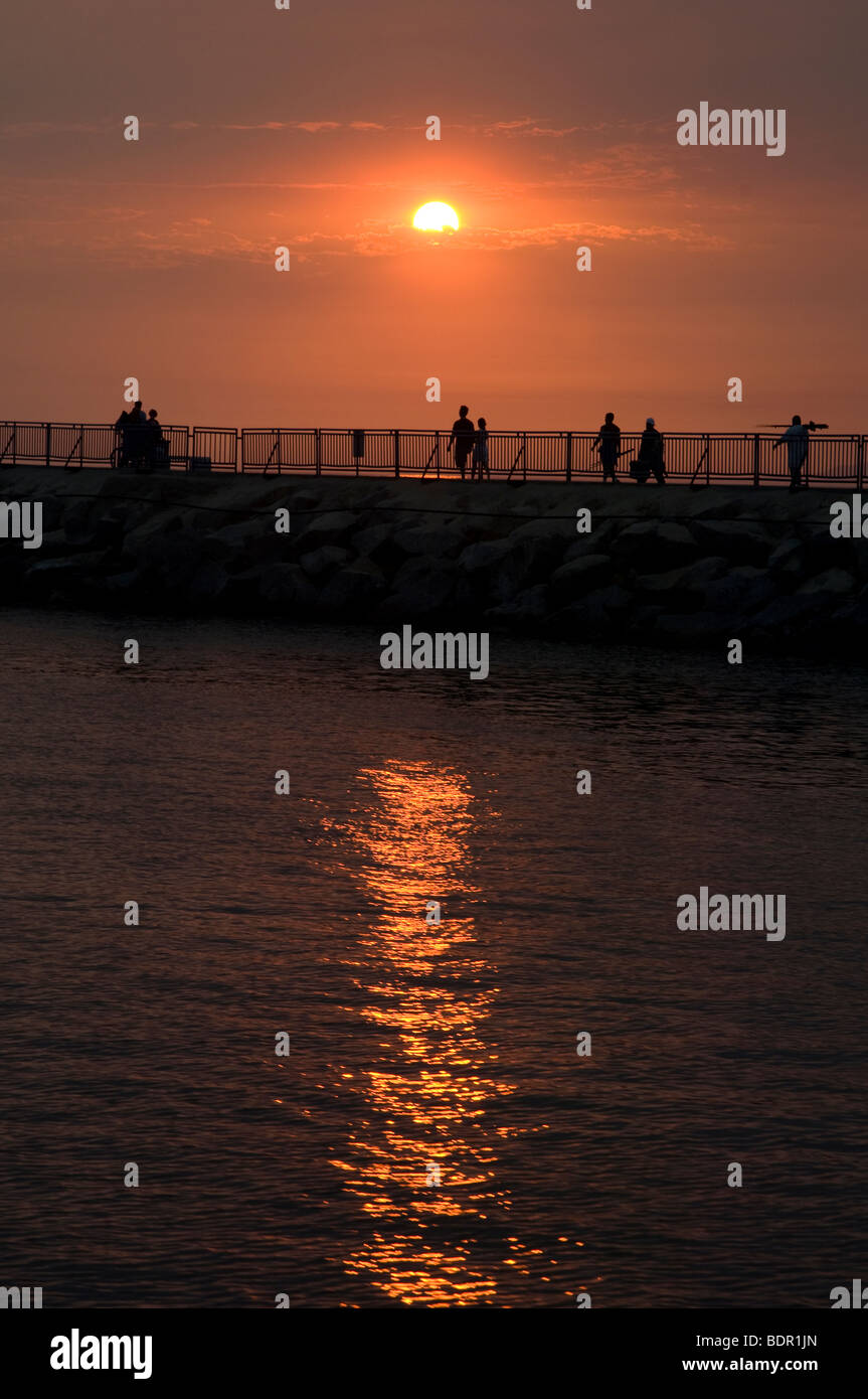 People Walking at Sunset Stock Photo - Alamy