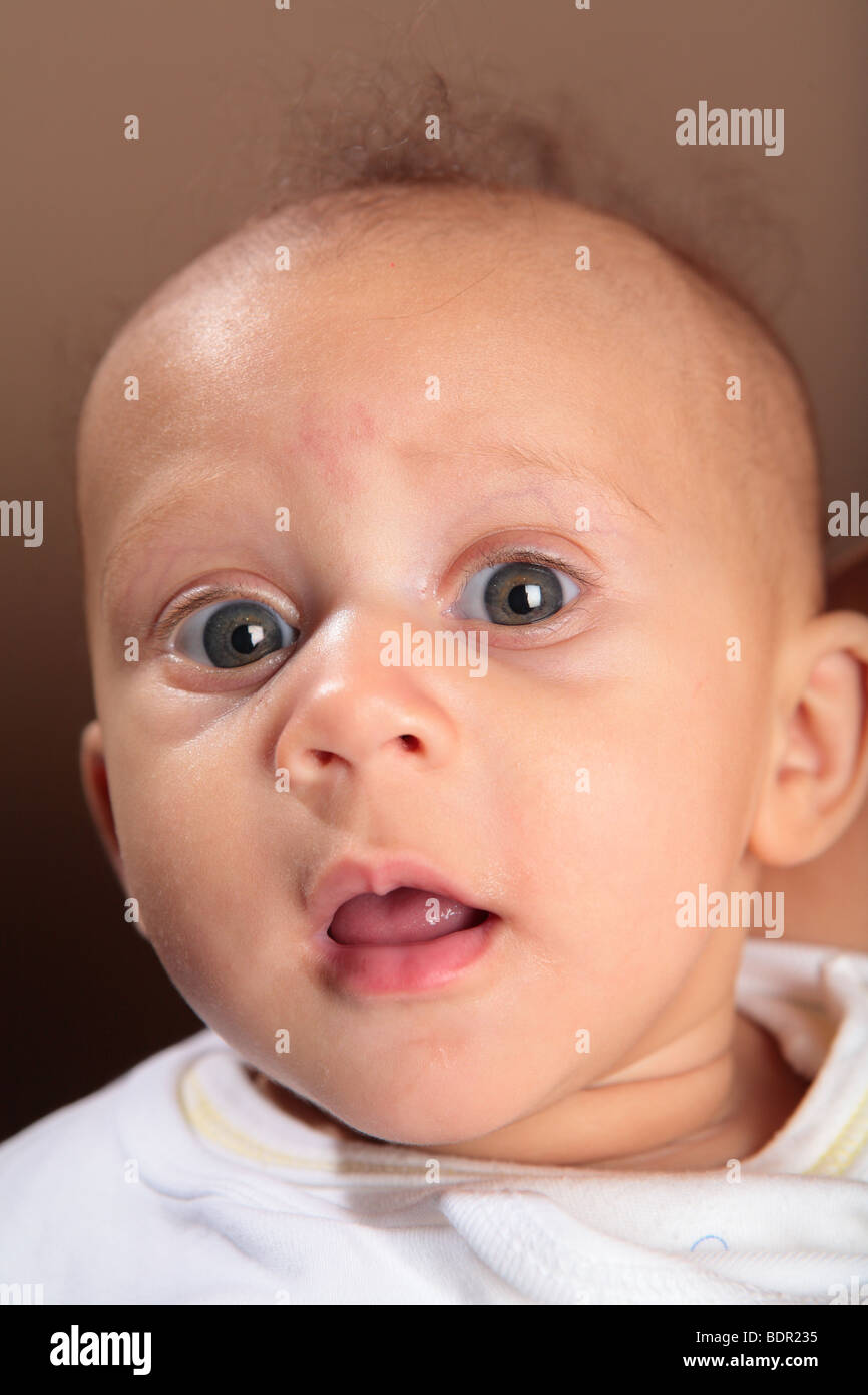 Infant with big eyes and open mouth hi-res stock photography and images ...