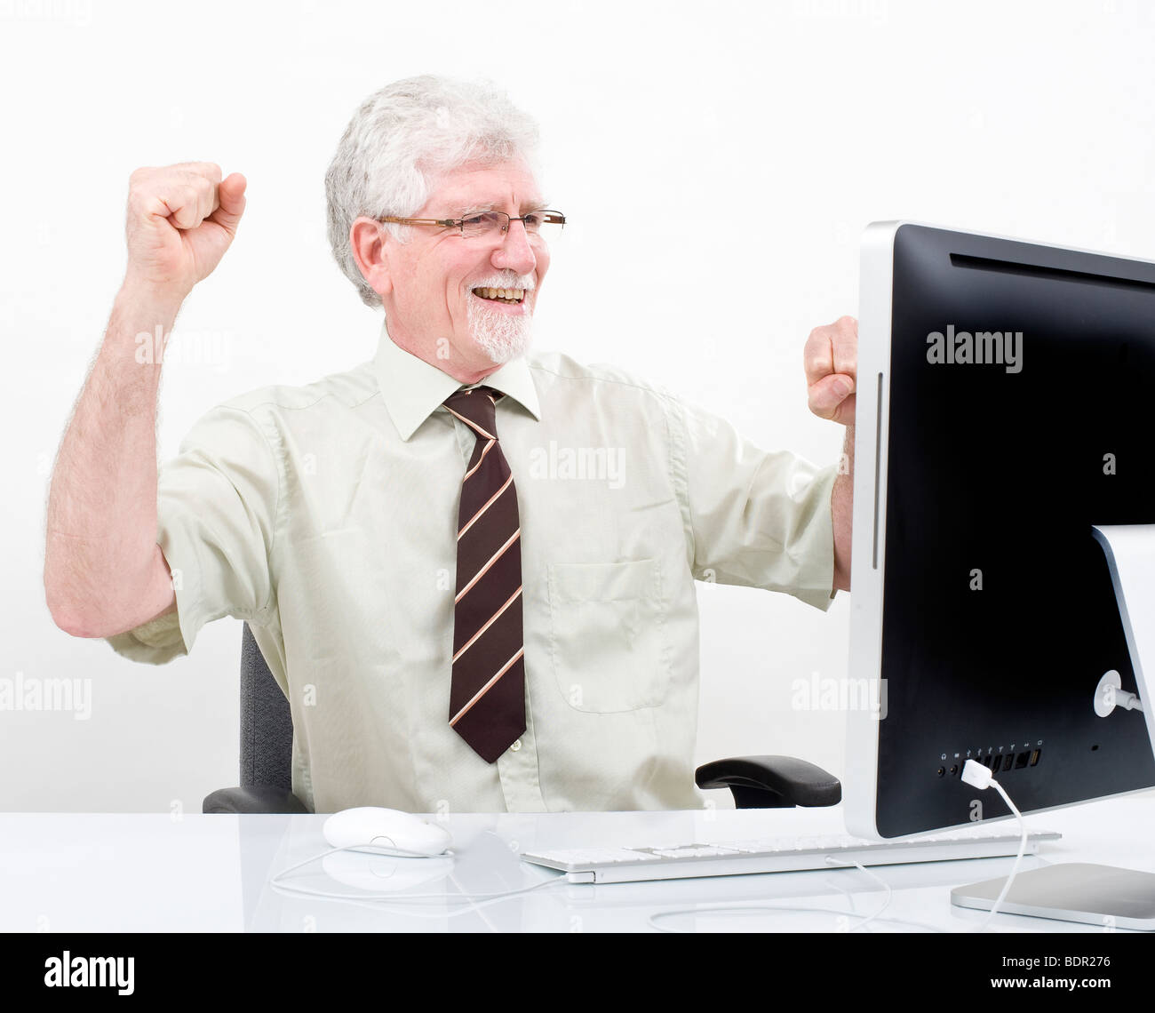 senior businessman winning in front of computer over white Stock Photo ...