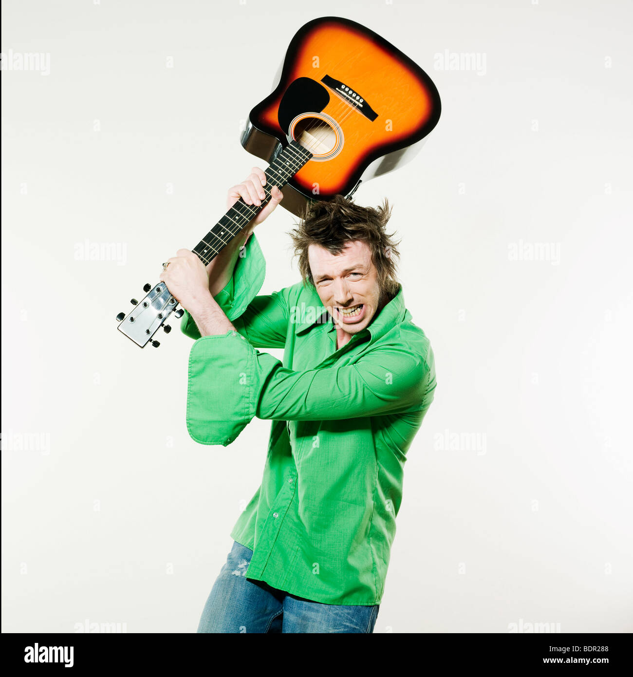 studio shot pictures on isolated background of a angry man holding a ...