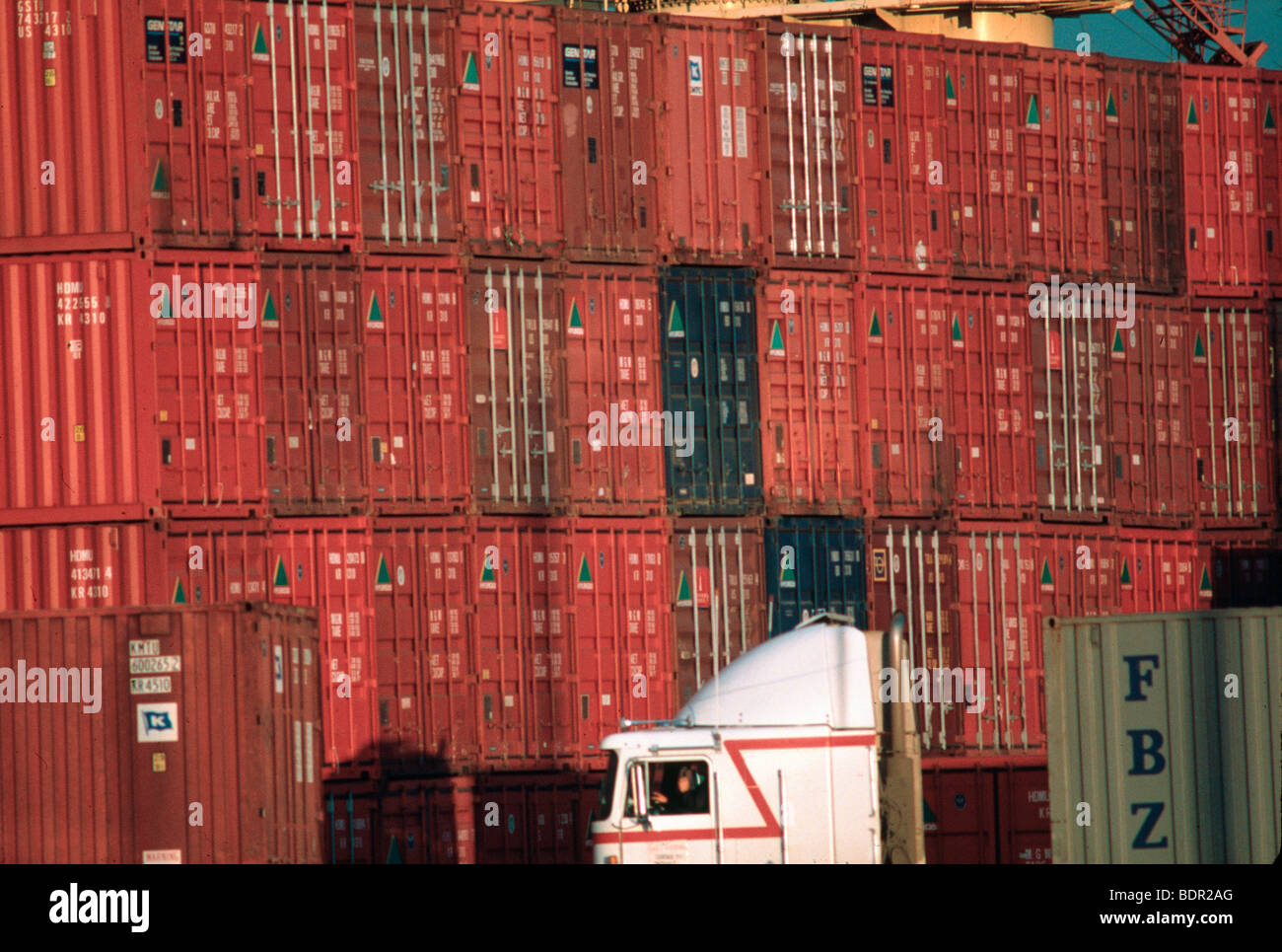 Shipping containers and truck at Port of Seattle Stock Photo - Alamy