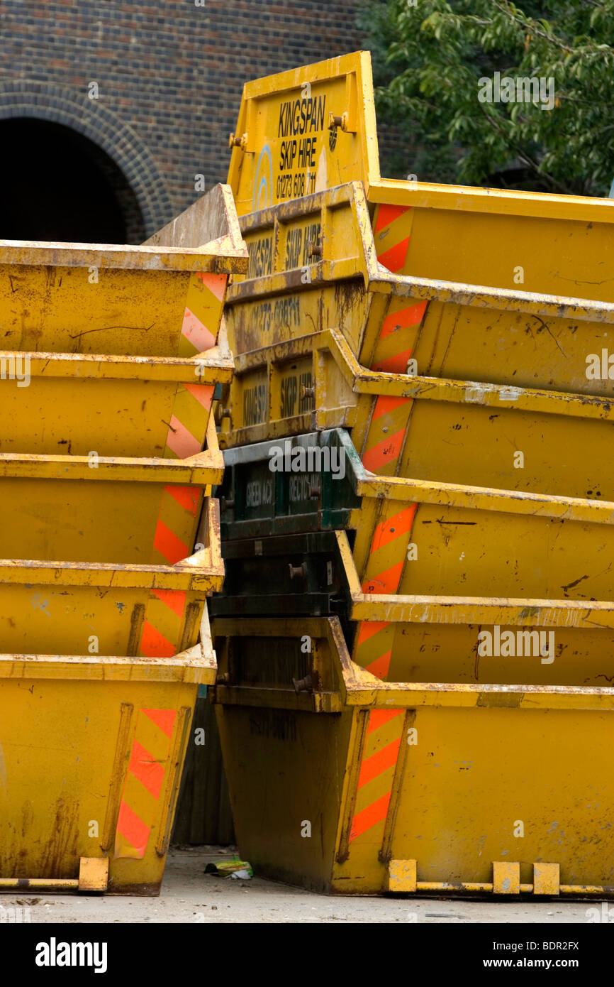 A stack of empty yellow skips ready to be hired out in Brighton, East ...