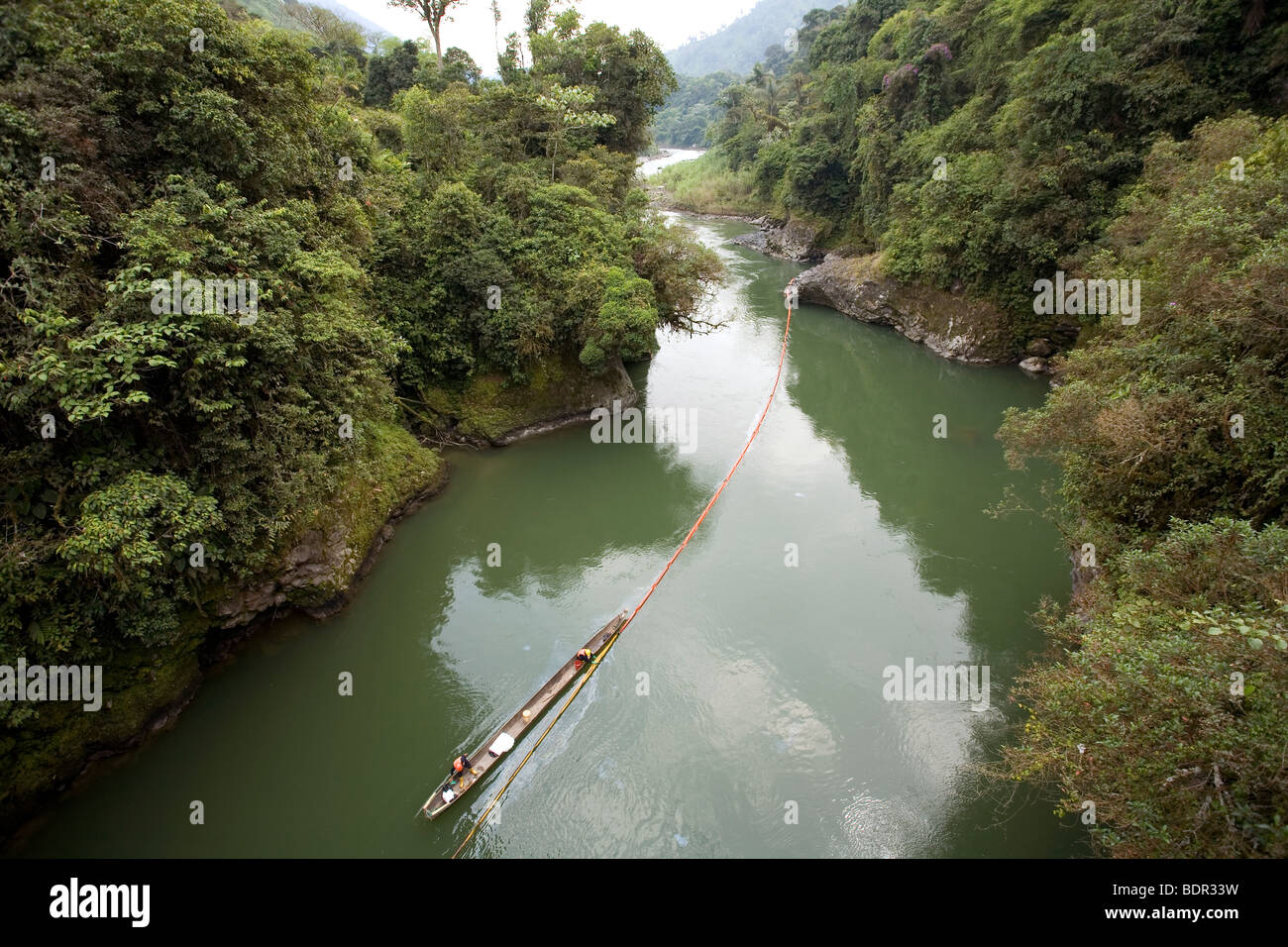 Floating boom placed in an Amazonian river in Ecuador to contain an oil ...