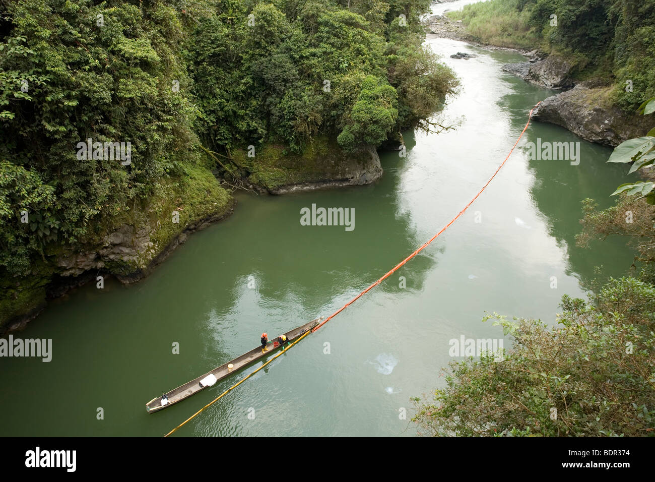Floating boom placed in an Amazonian river in Ecuador to contain an oil ...