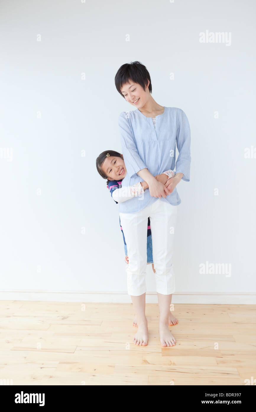 Mother and daughter standing Stock Photo - Alamy