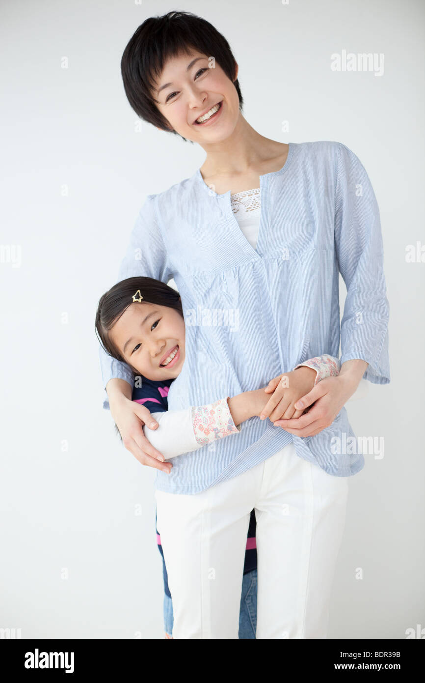 Mother and daughter standing Stock Photo - Alamy