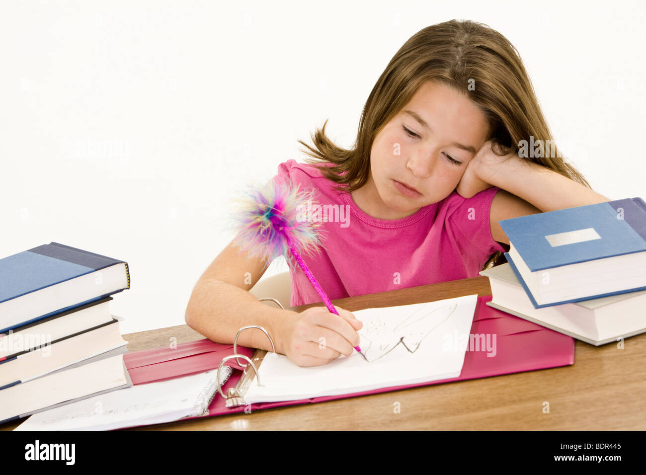 Child working on homework on white background Stock Photo - Alamy