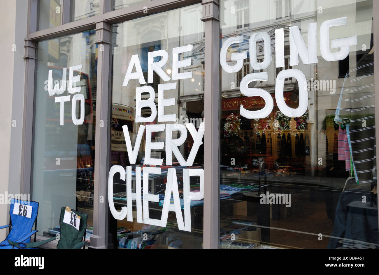 WE ARE GOING TO BE SO CHEAP sign in shop window Stock Photo - Alamy