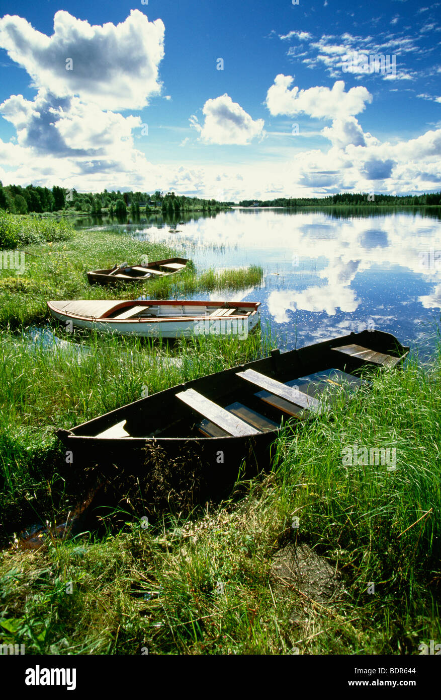 Rowing-boats in a lake Lapland Sweden Stock Photo - Alamy