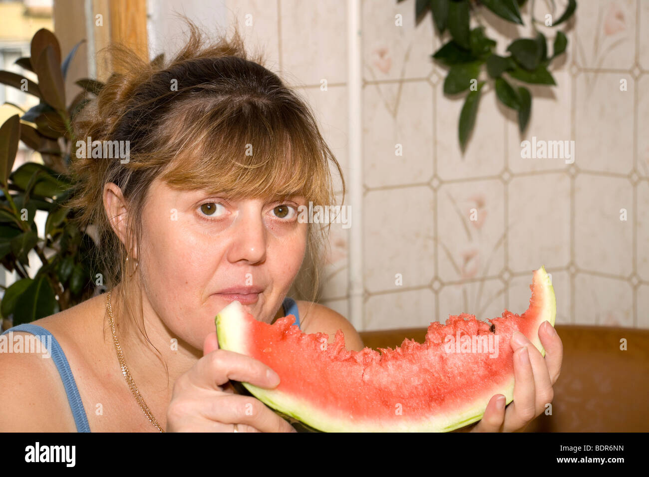 the woman with a bit of water-melon Stock Photo - Alamy