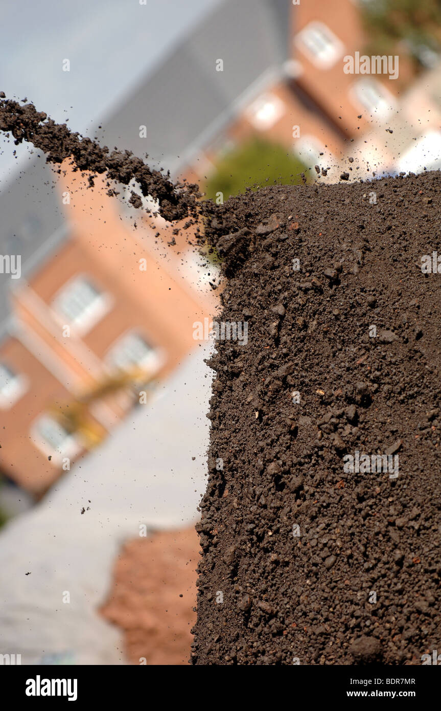 Earth falling from a truck Stock Photo - Alamy