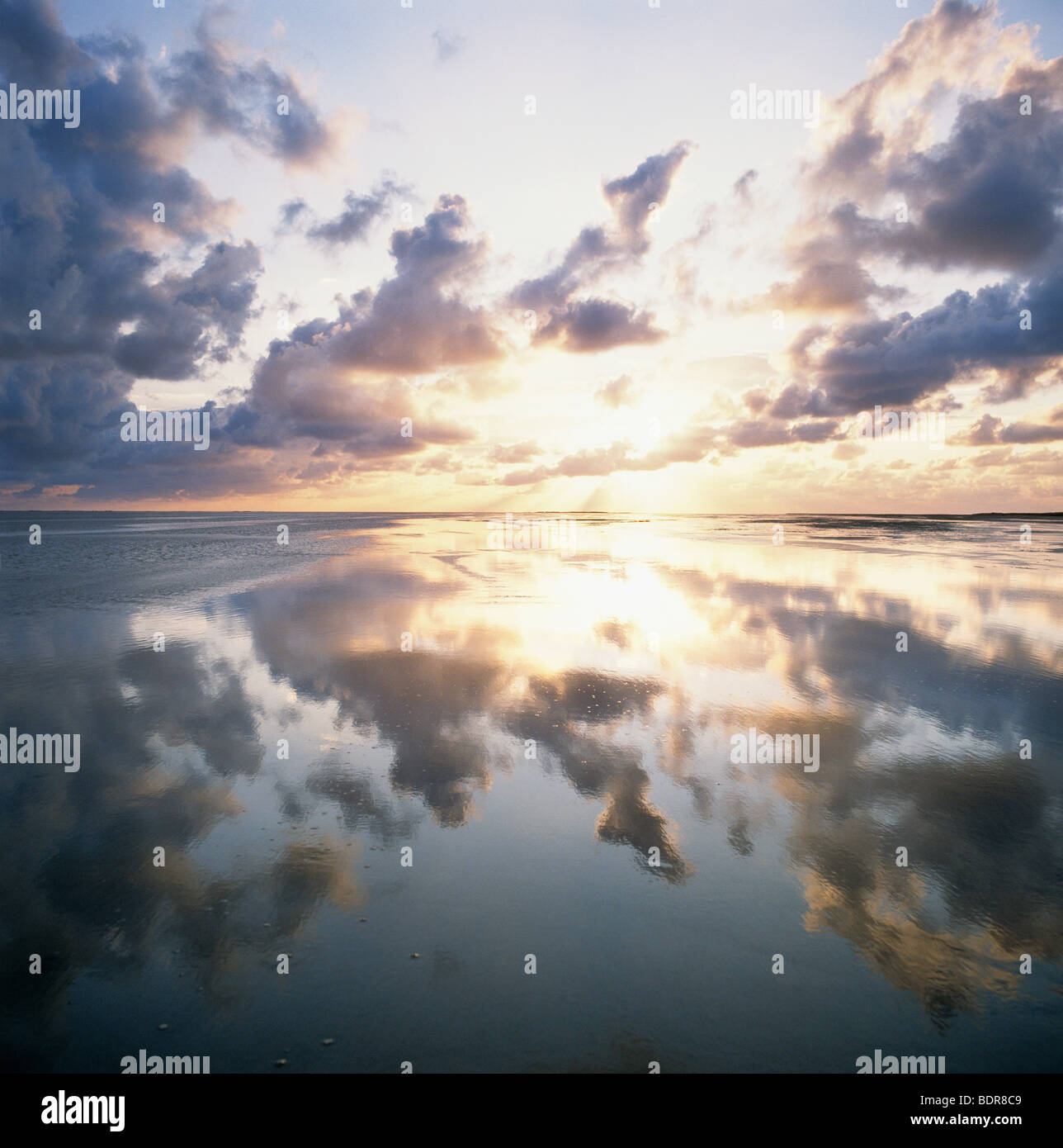 Reflection of sky and clouds on sea, Denmark Stock Photo - Alamy