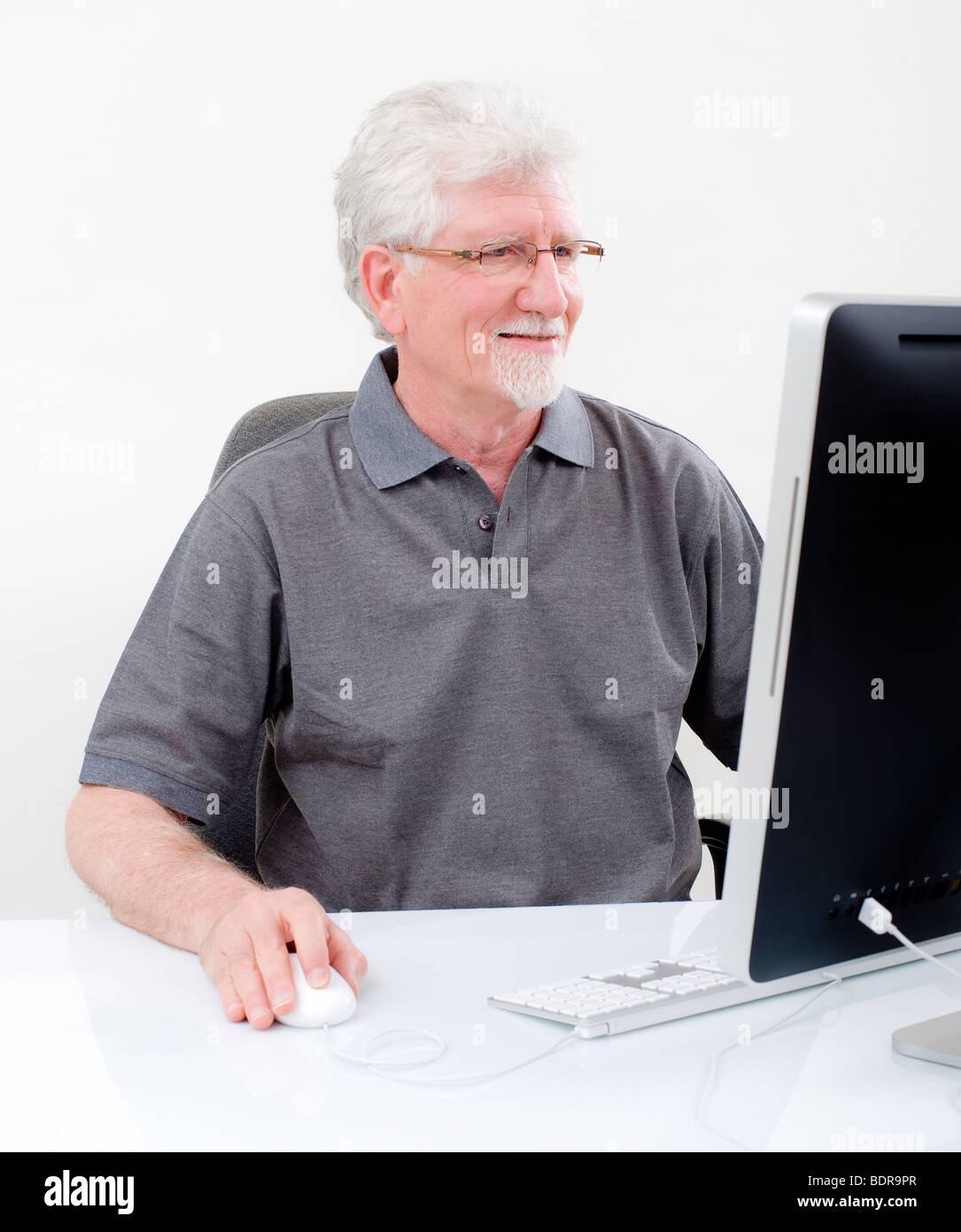 Computer mature man Cut Out Stock Images & Pictures - Alamy