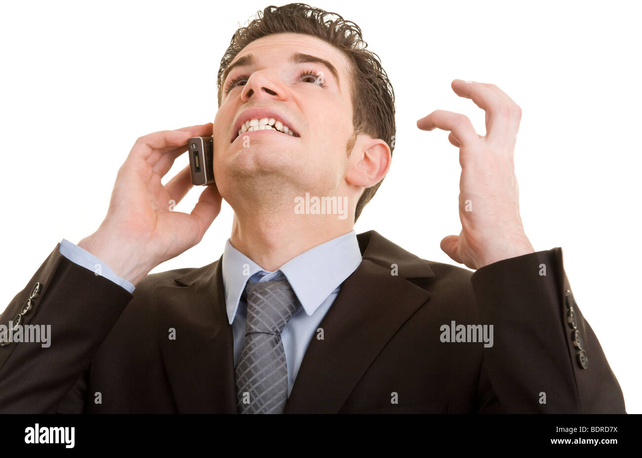 Junger mann im anzug telefoniert hi-res stock photography and images ...