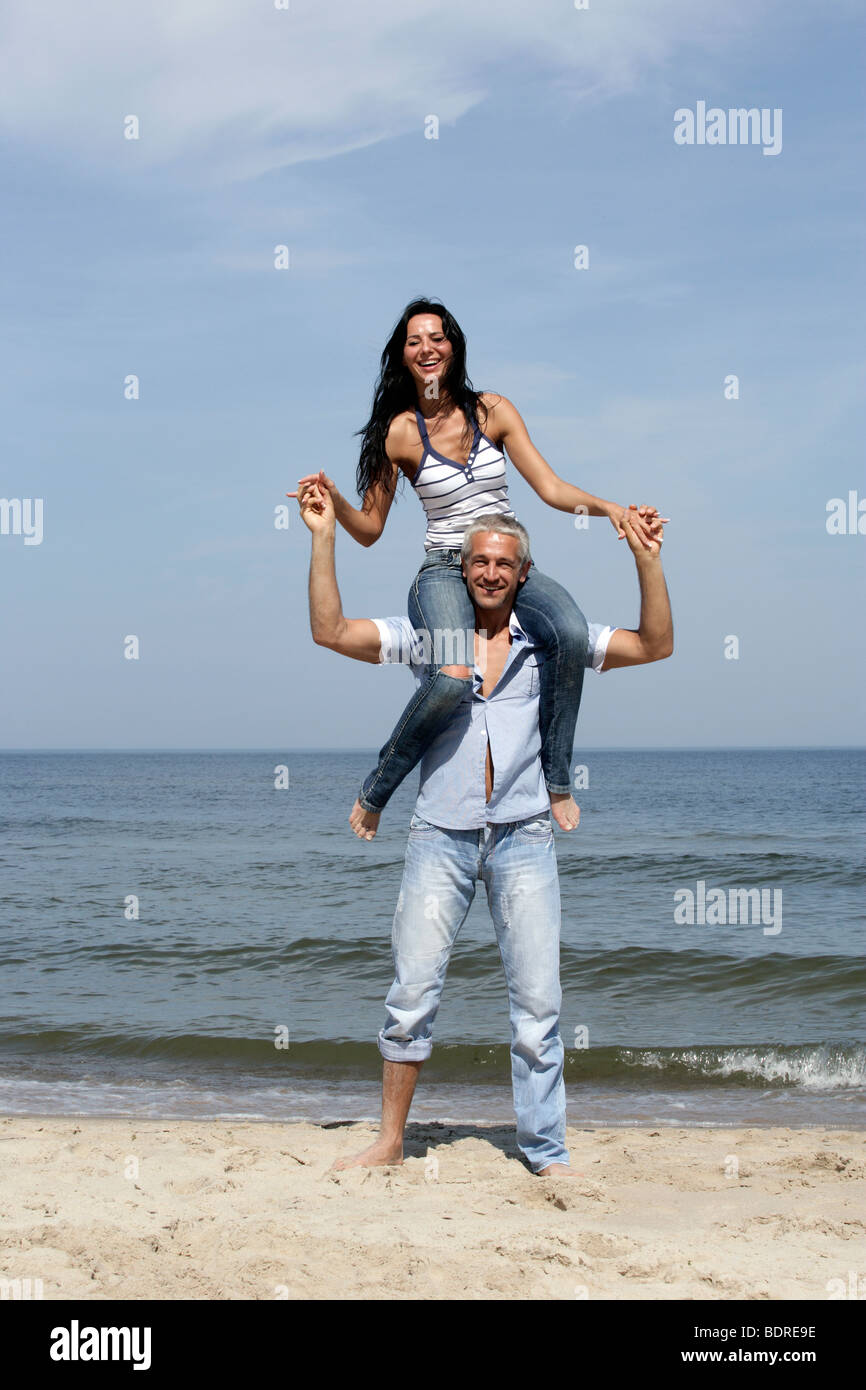 Woman standing on mans back hi-res stock photography and images - Alamy