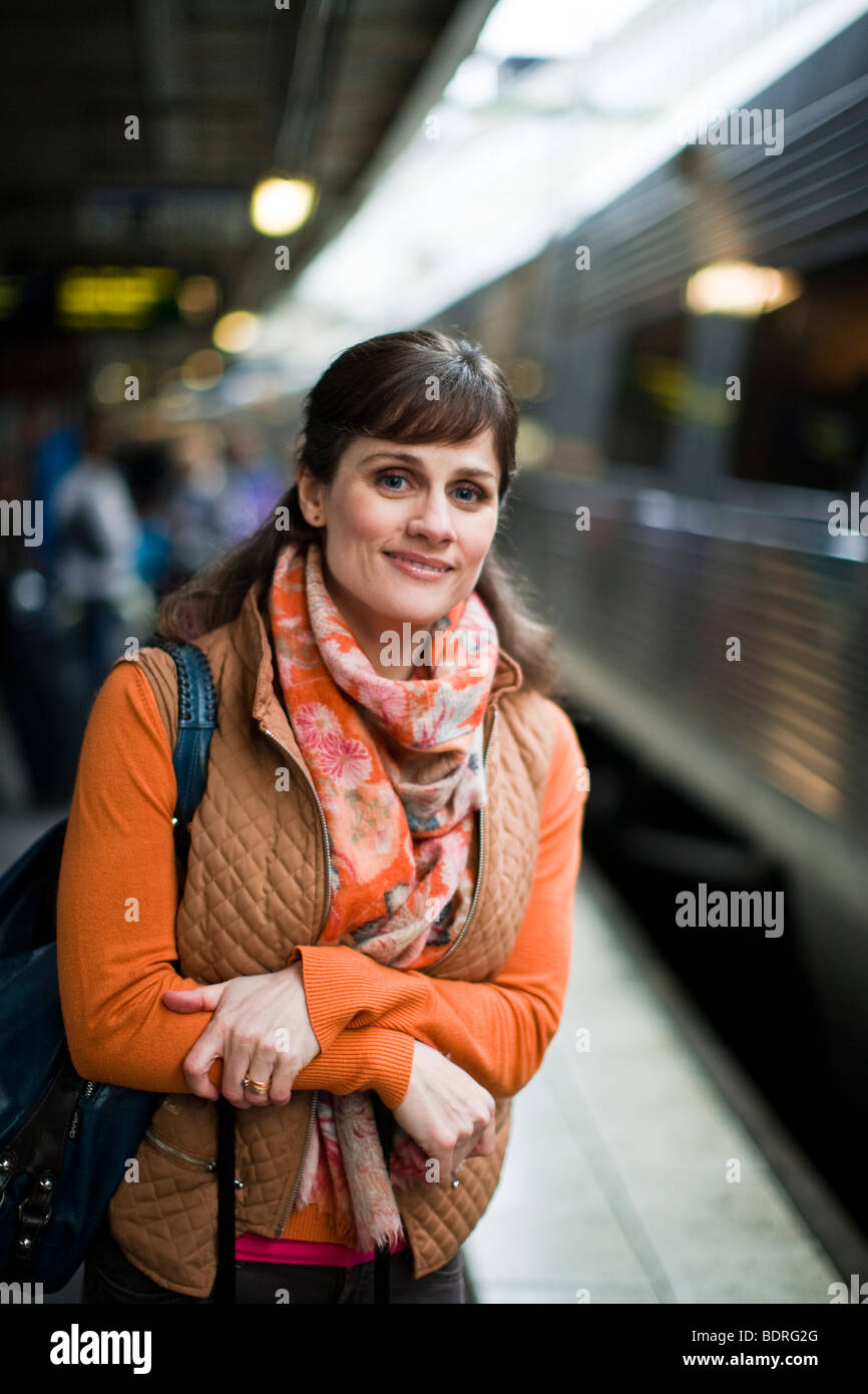 A woman at a railway station Stock Photo - Alamy