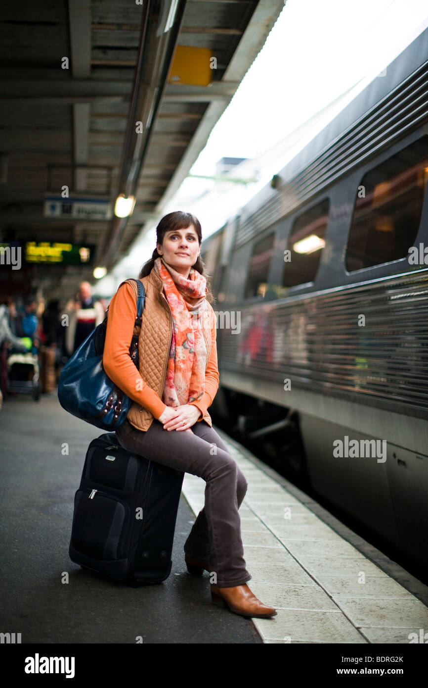 A woman at a railway station Stock Photo - Alamy