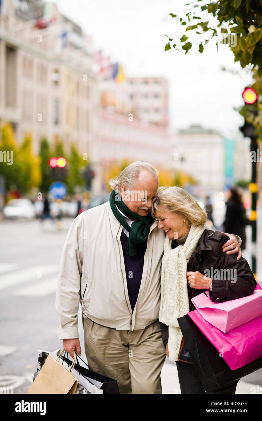 Old lady carrying bags hi-res stock photography and images - Alamy