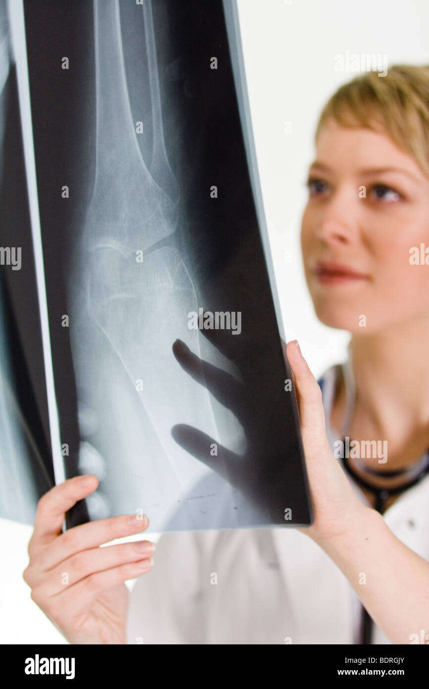 A female doctor holding an X-ray plate Stock Photo - Alamy