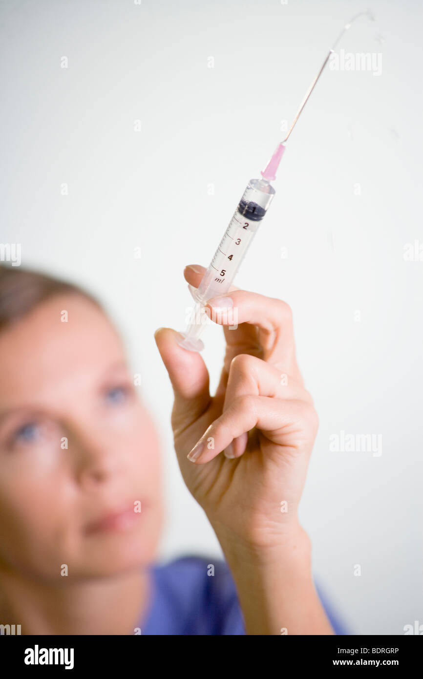 Nurse preparing injection close-up Stock Photo - Alamy