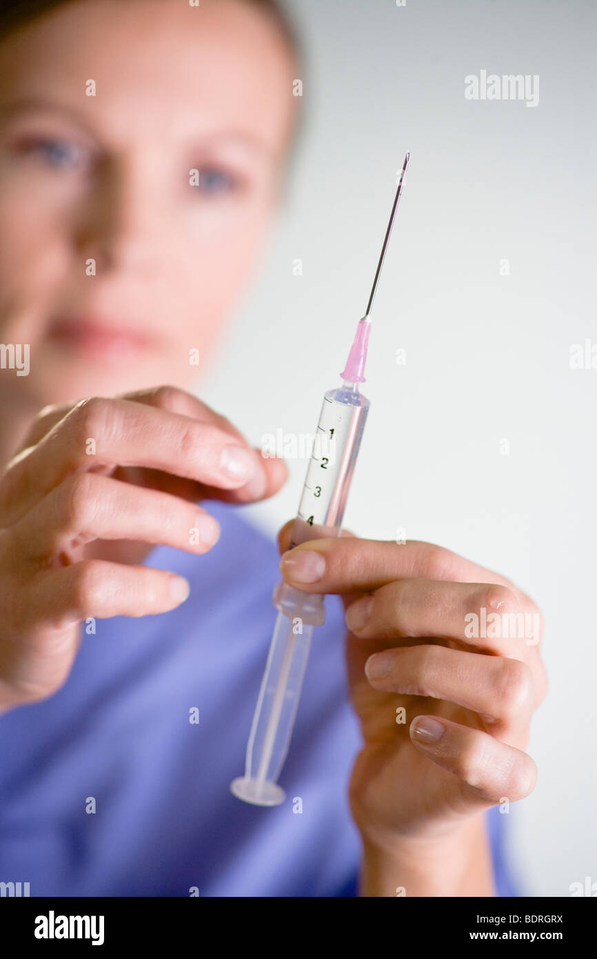 Nurse preparing injection close-up Stock Photo - Alamy