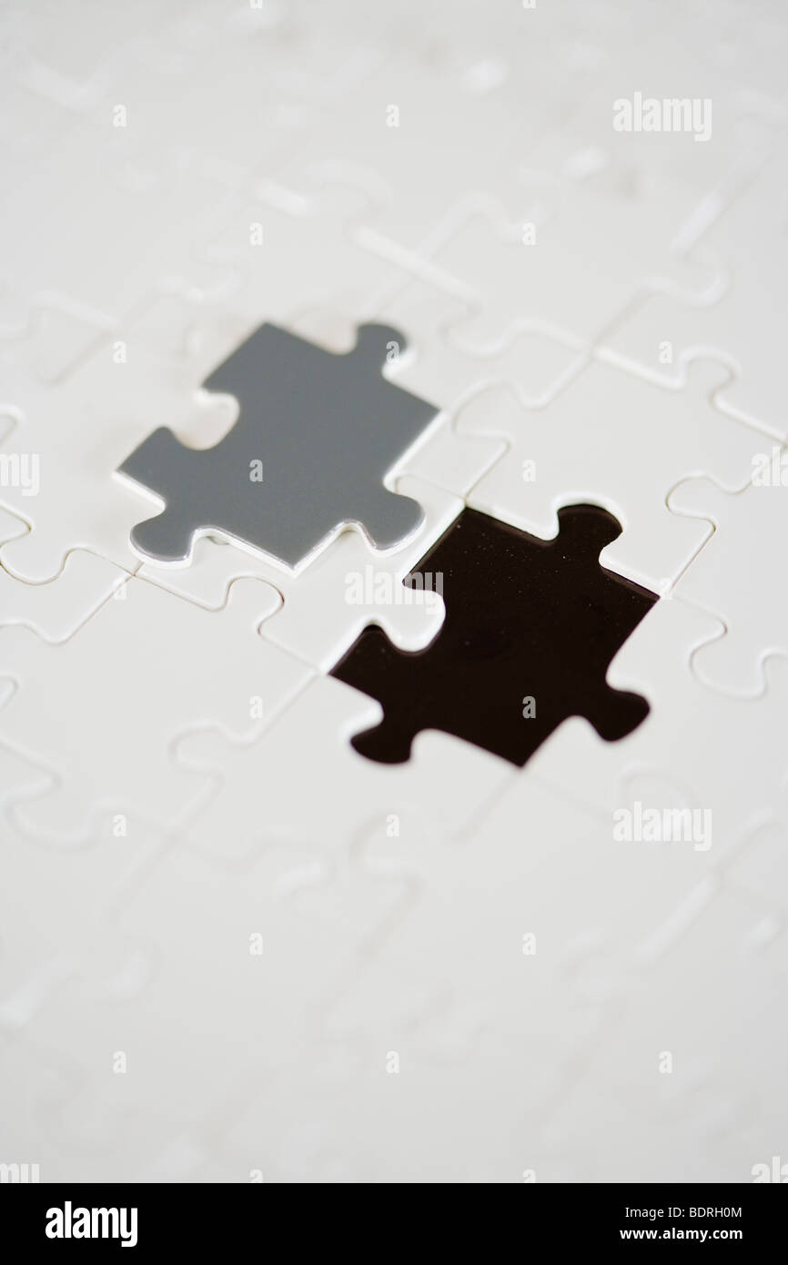A puzzle with a missing piece Stock Photo - Alamy
