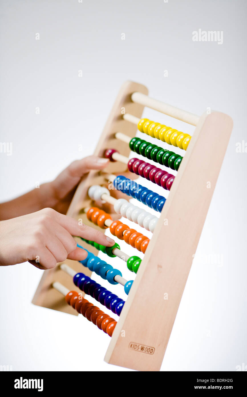 A woman using an abacus Stock Photo - Alamy