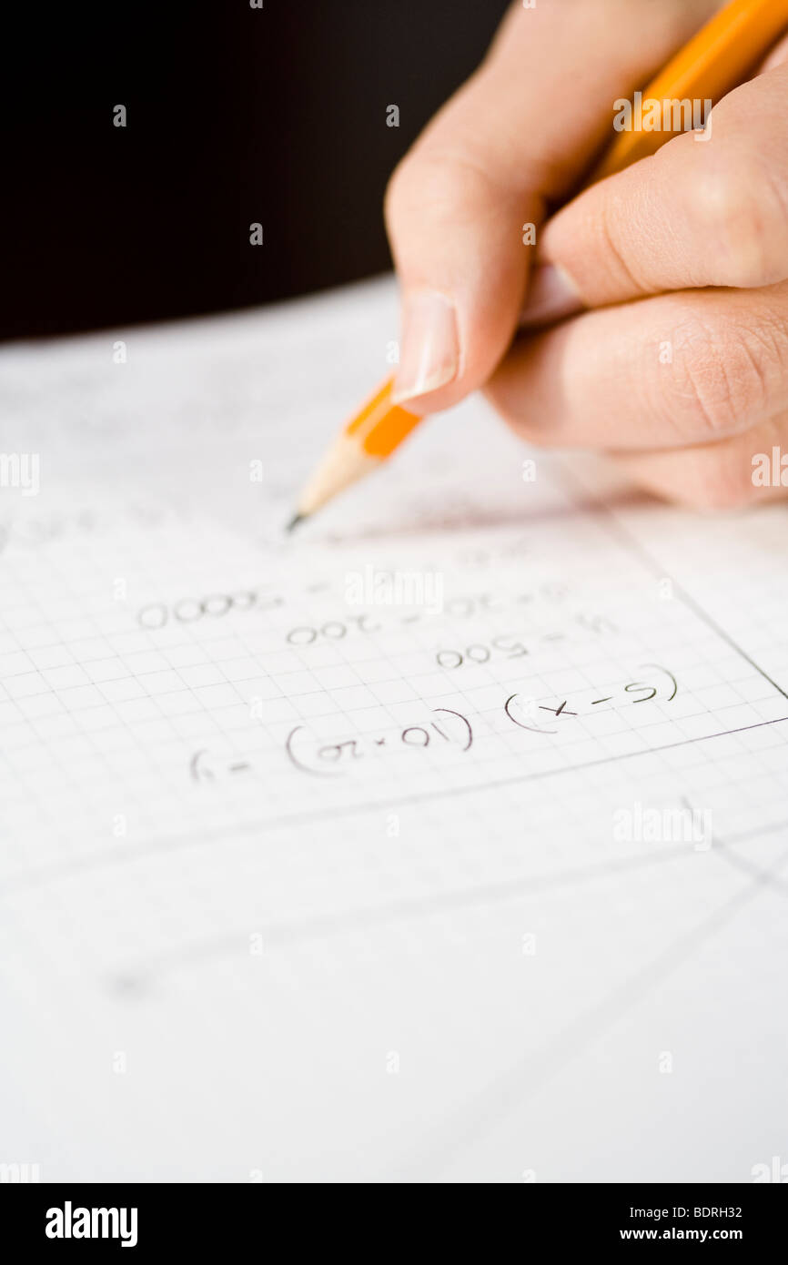 A woman working out a sum close-up Stock Photo - Alamy