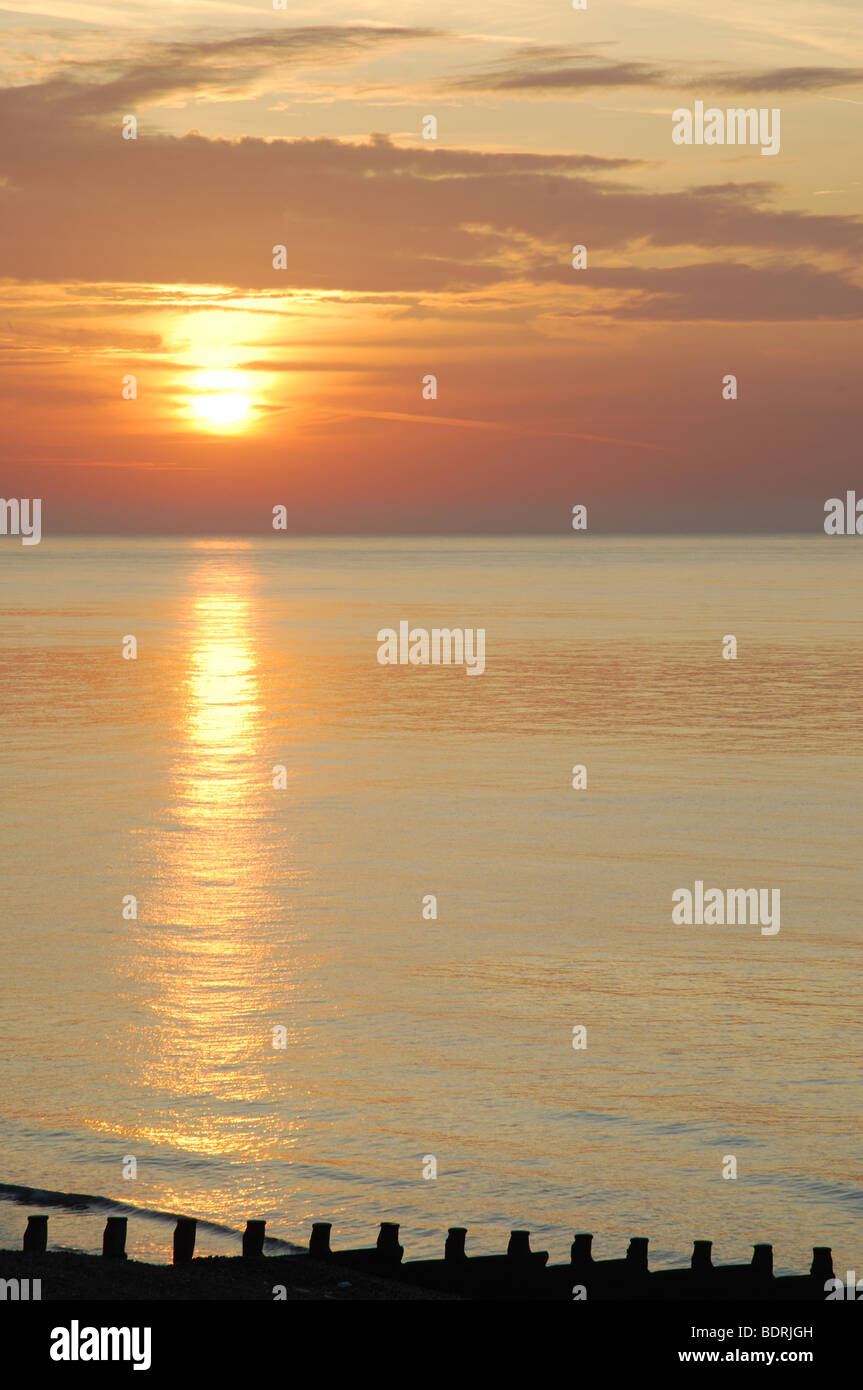 Beautiful clouds with beams of light breaking the setting sun hi-res ...