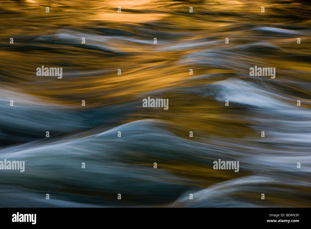 Early evening reflected light on rapids of Merced River, Yosemite ...